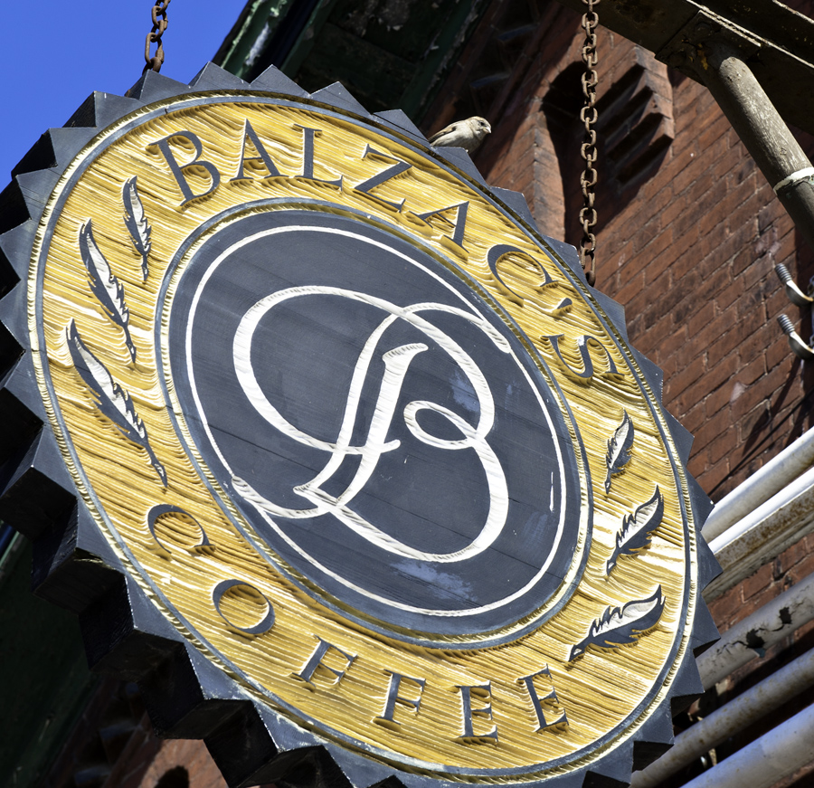 Bird on top of the Balzac Coffee sign, Distillery district, Toronto ...